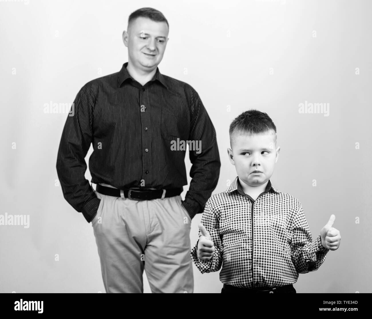 cool and serious. father and son in business suit. male fashion. happy ...