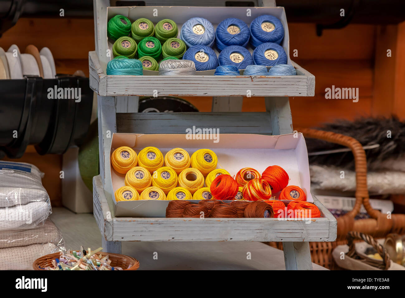 Display of different coloured needlework threads Stock Photo - Alamy