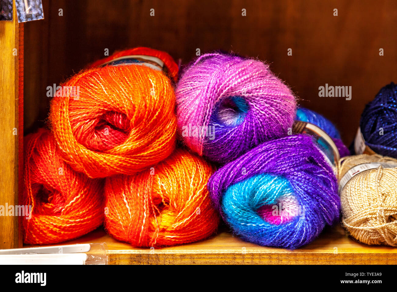 Display of different coloured knitting wools Stock Photo - Alamy
