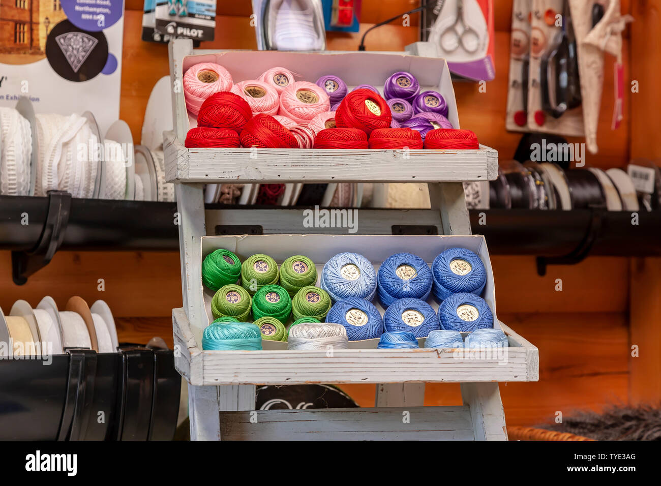 Display of different coloured needlework threads Stock Photo - Alamy