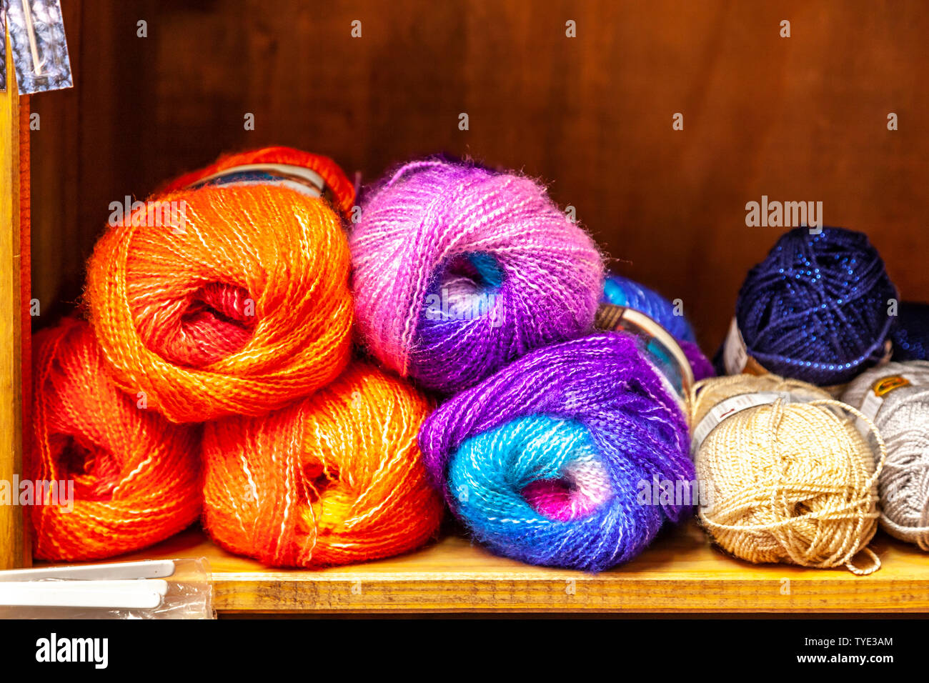 Display of different coloured knitting wools Stock Photo - Alamy