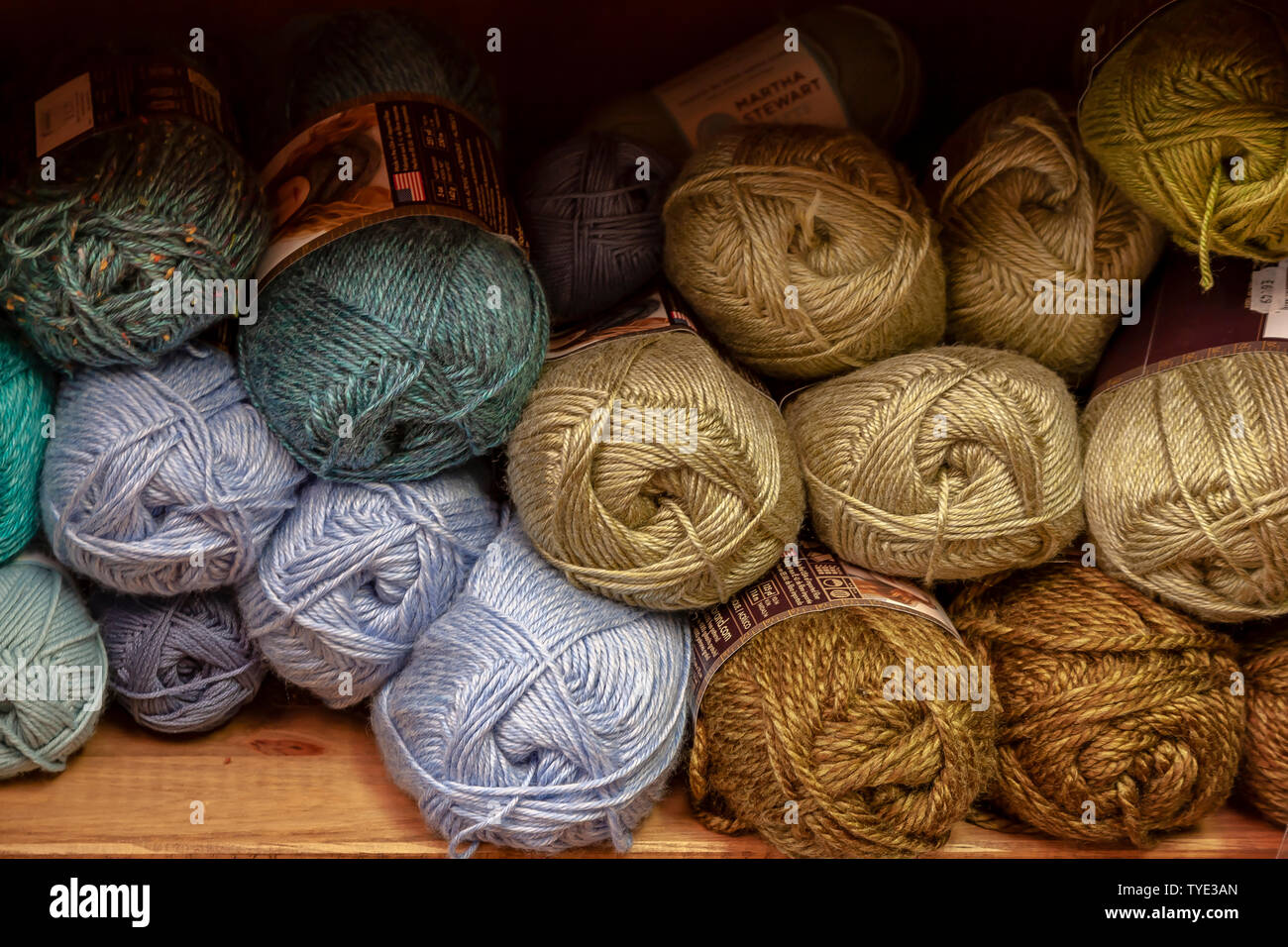Display of different coloured knitting wools Stock Photo - Alamy