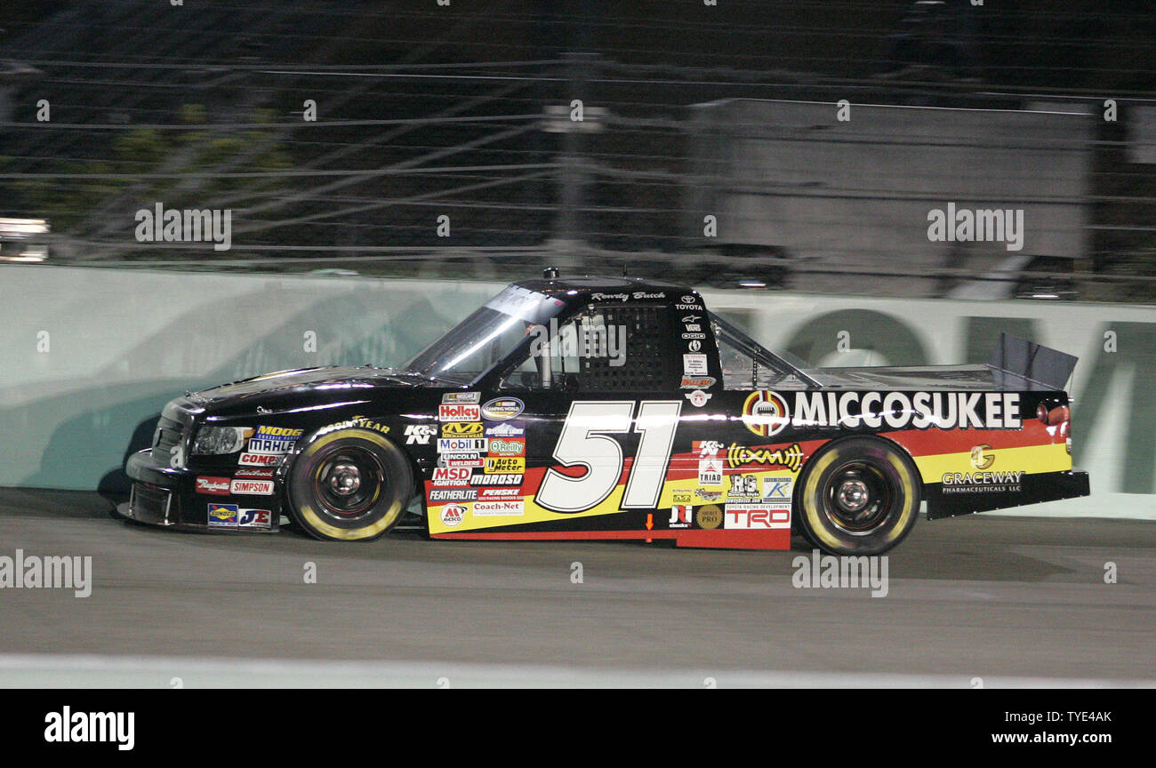 Kyle Busch runs on the front-stretch in early race action during the ...