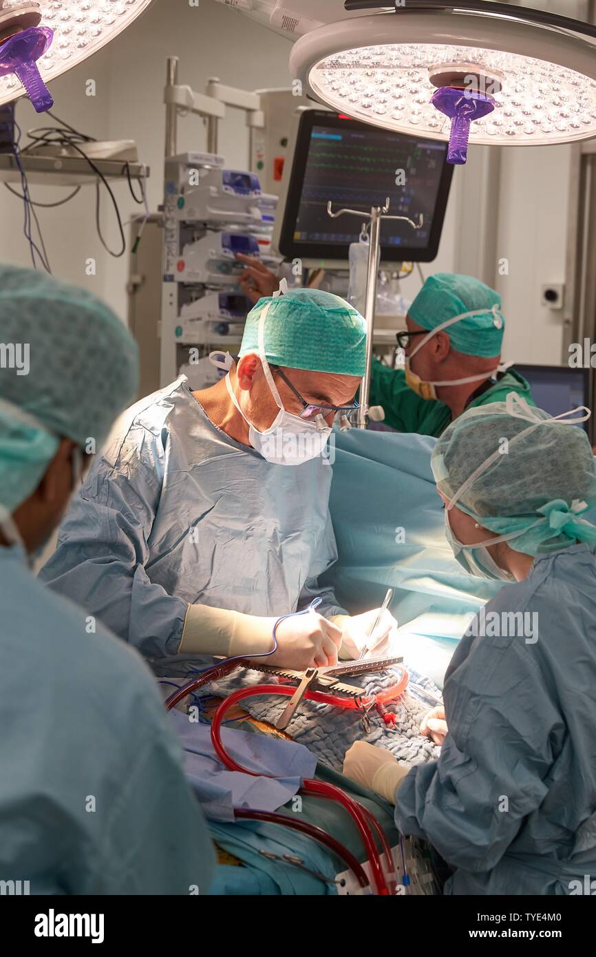 Heart surgeon Prof. Richard Frey with team during a heart operation in ...