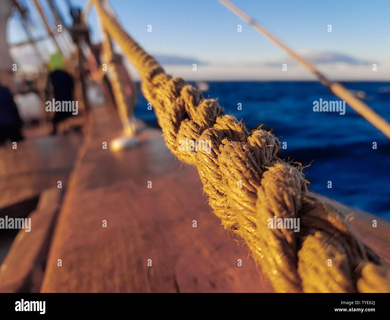 Railing of an old sailing ship coming across the sea with the roll ...