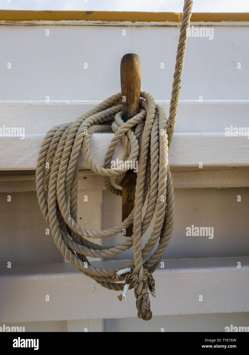 Nagel and coil of rope on the white board of the old schooner Stock ...