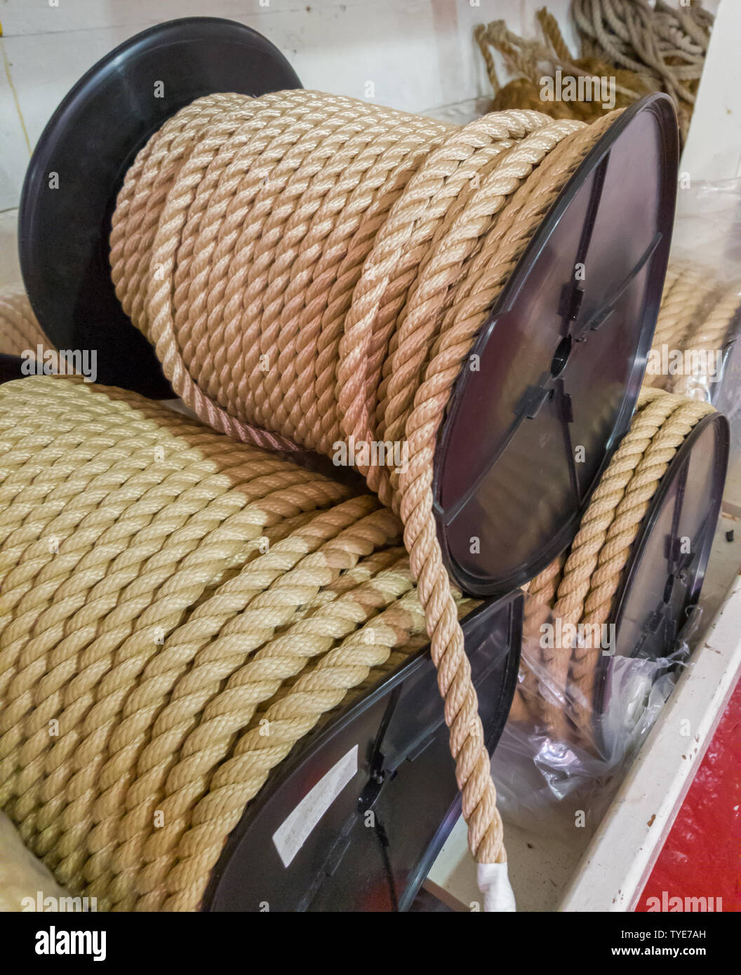 Large synthetic rope coils in the warehouse of the ship. Selective ...