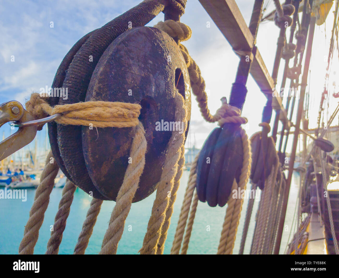 Old wooden deadeye on the shrouds of a tall ship of the eighteenth ...