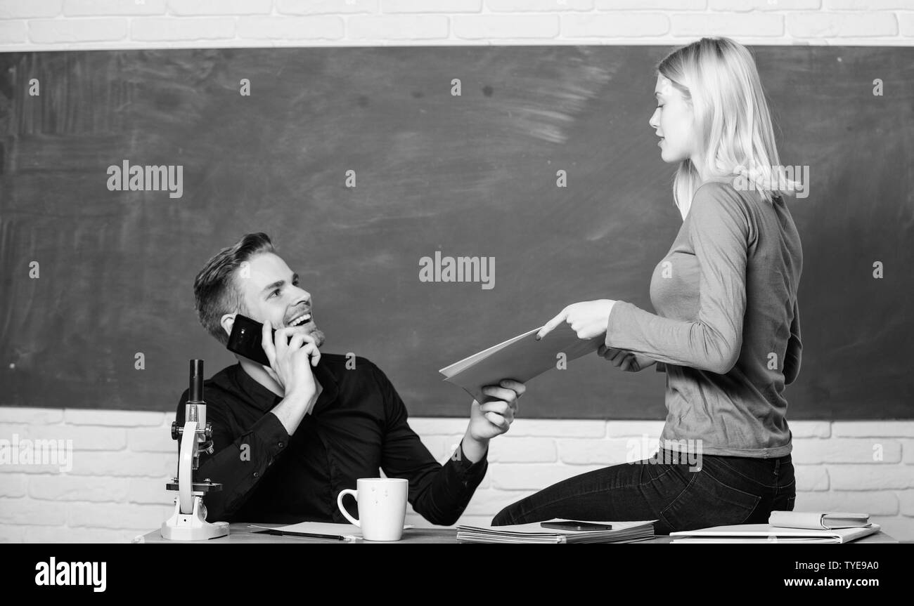 Teacher grading homework in classroom hi-res stock photography and ...