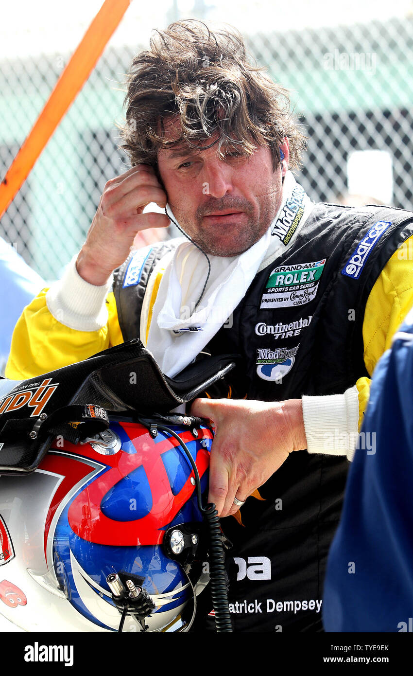 Actor Patrick Dempsey takes off his helmet in his pit during practice ...
