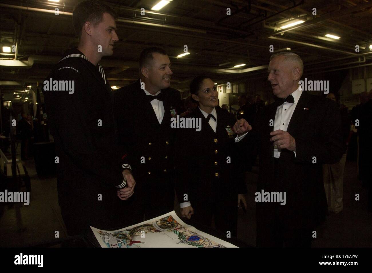 U.S. Marine Corps Gen. (Ret.) James Mattis, right, speaks to U.S. Navy ...