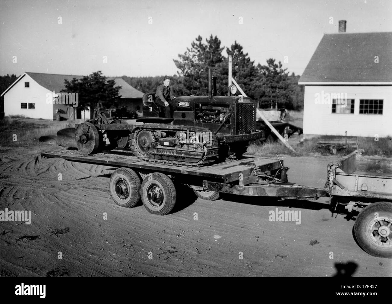 Photograph of Tractor and Plow Loaded on a Trailer; Scope and content ...