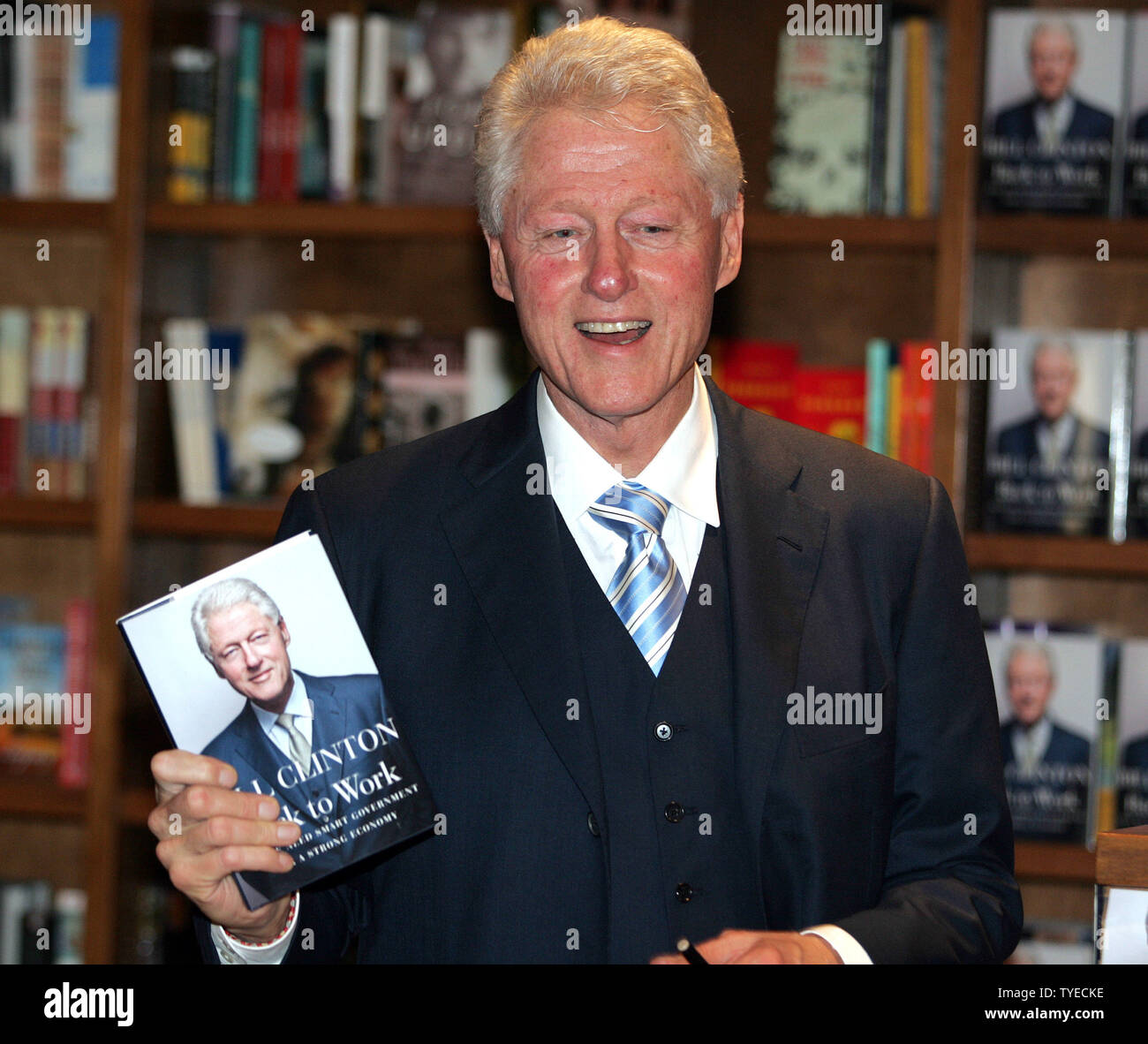 Former US President Bill Clinton signs copies of his new book "Back to ...