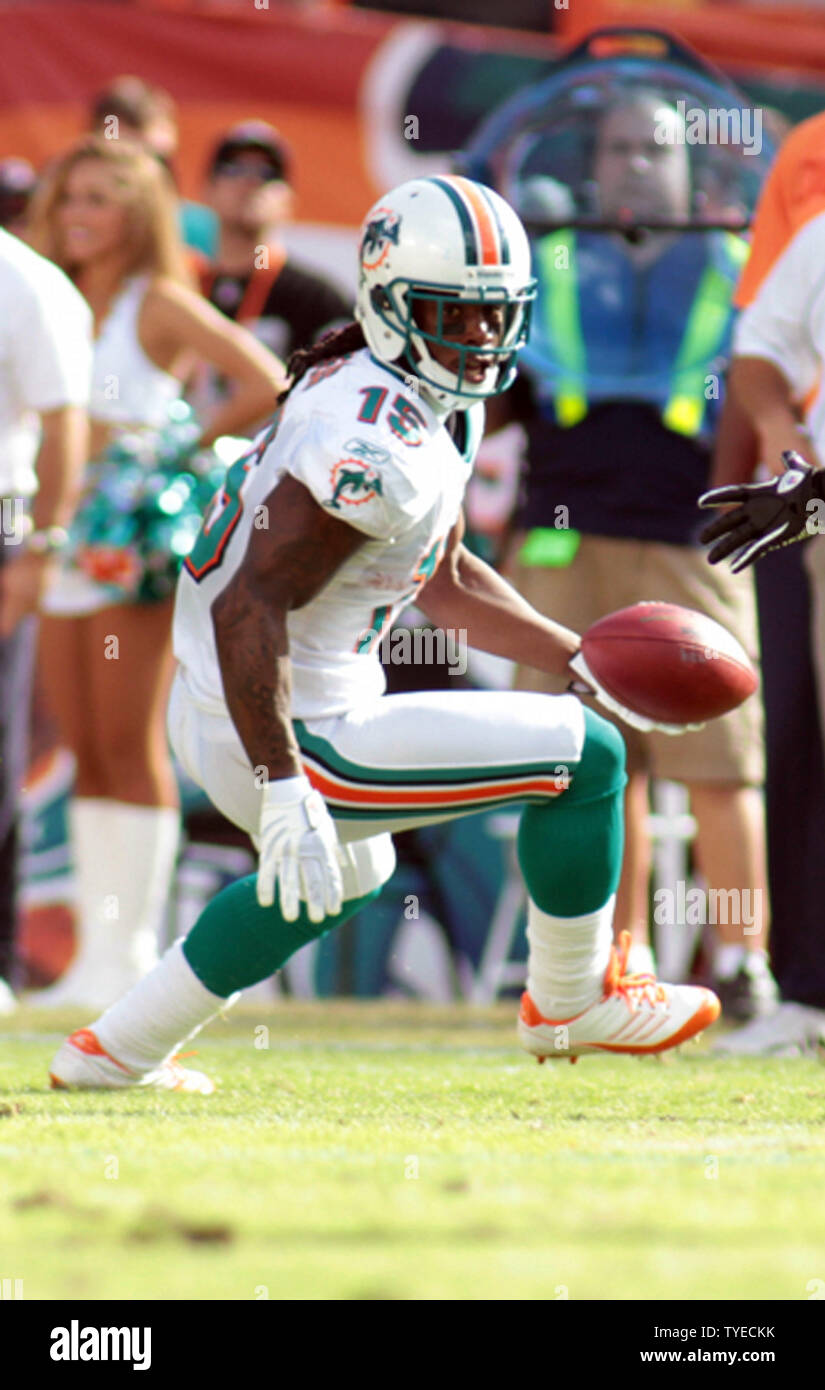 Miami Dolphins wide receiver Devon Bess (15) looks for running room ...