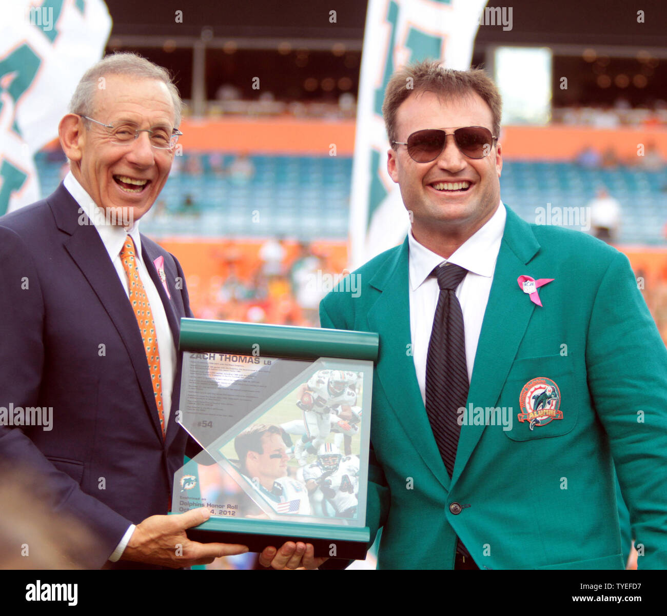 Miami Dolphins owner Steve Ross inducts Zach Thomas into the Honor Roll ...