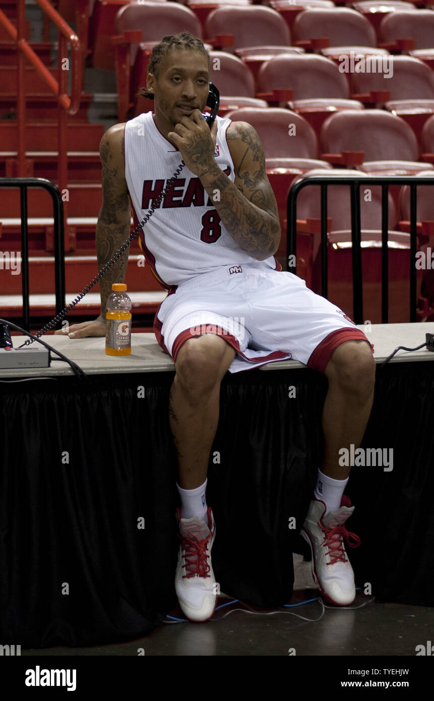 Miami Heat's Michael Beasley (8) talks to a reporter during the team's ...
