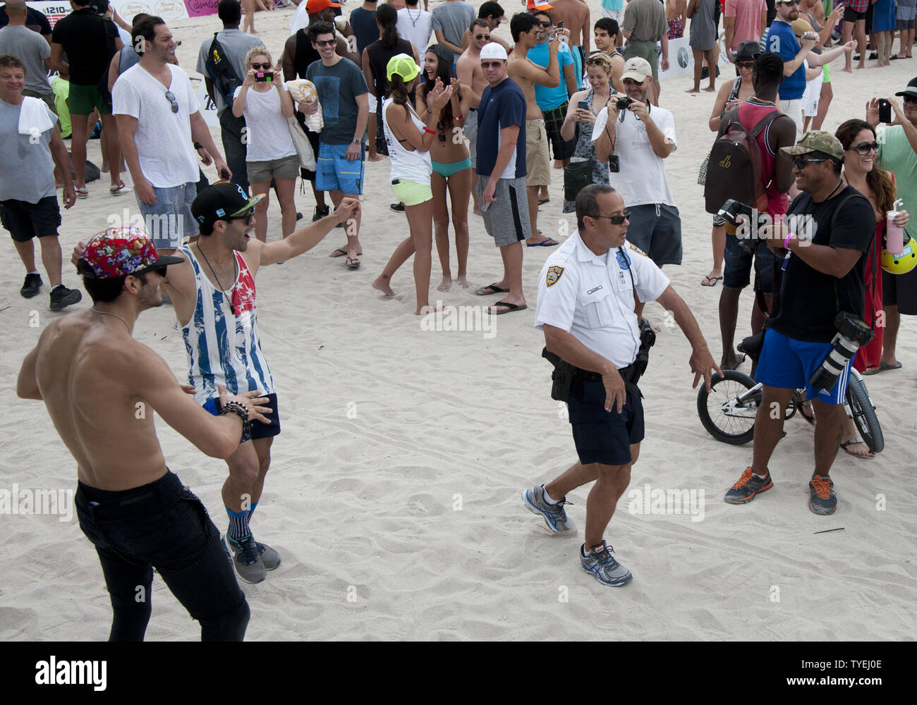 A Miami Beach police officer gets into the break dance spirit at the ...