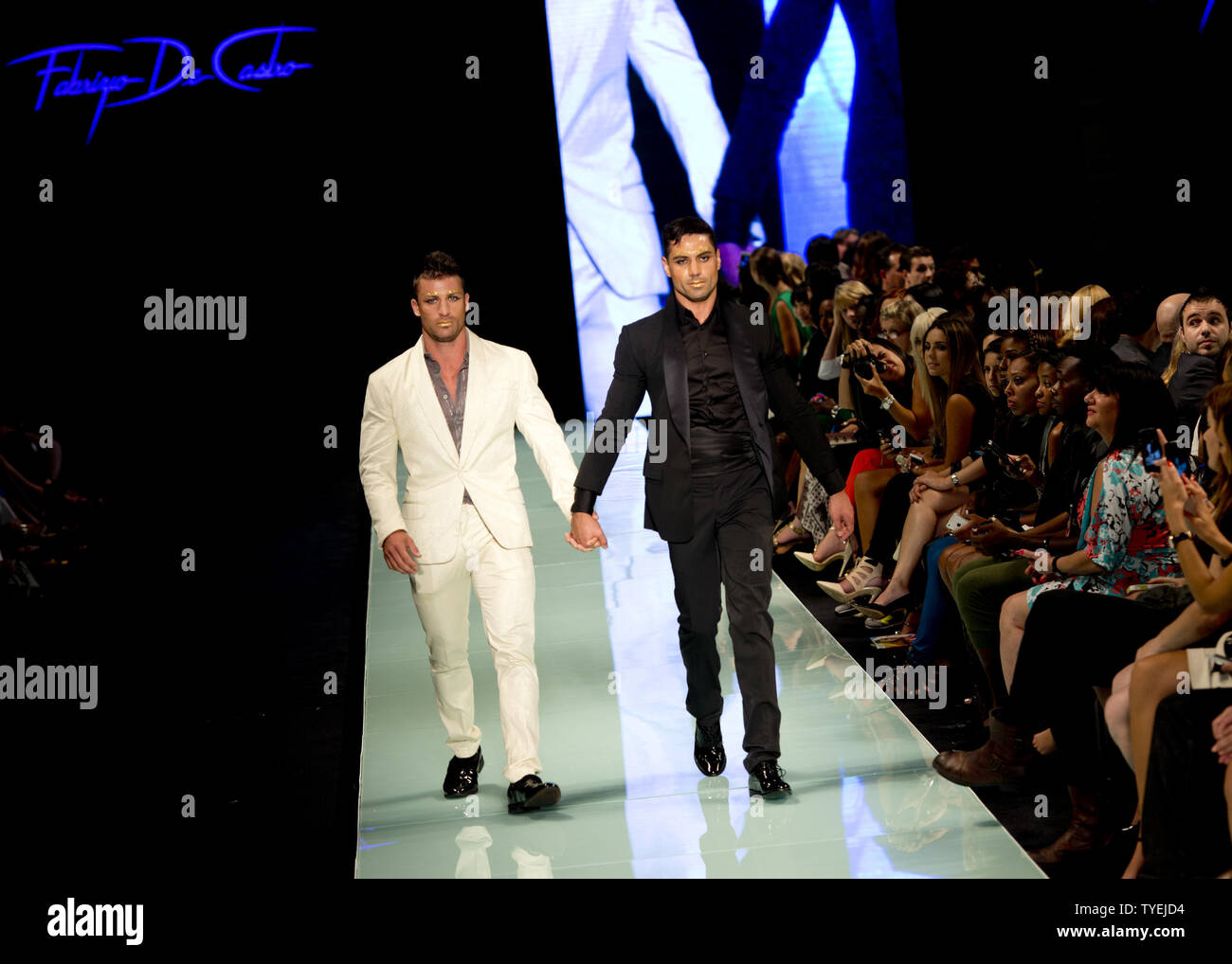 Two models from Fabrizio de Castro fashions walks on the runway at the ...