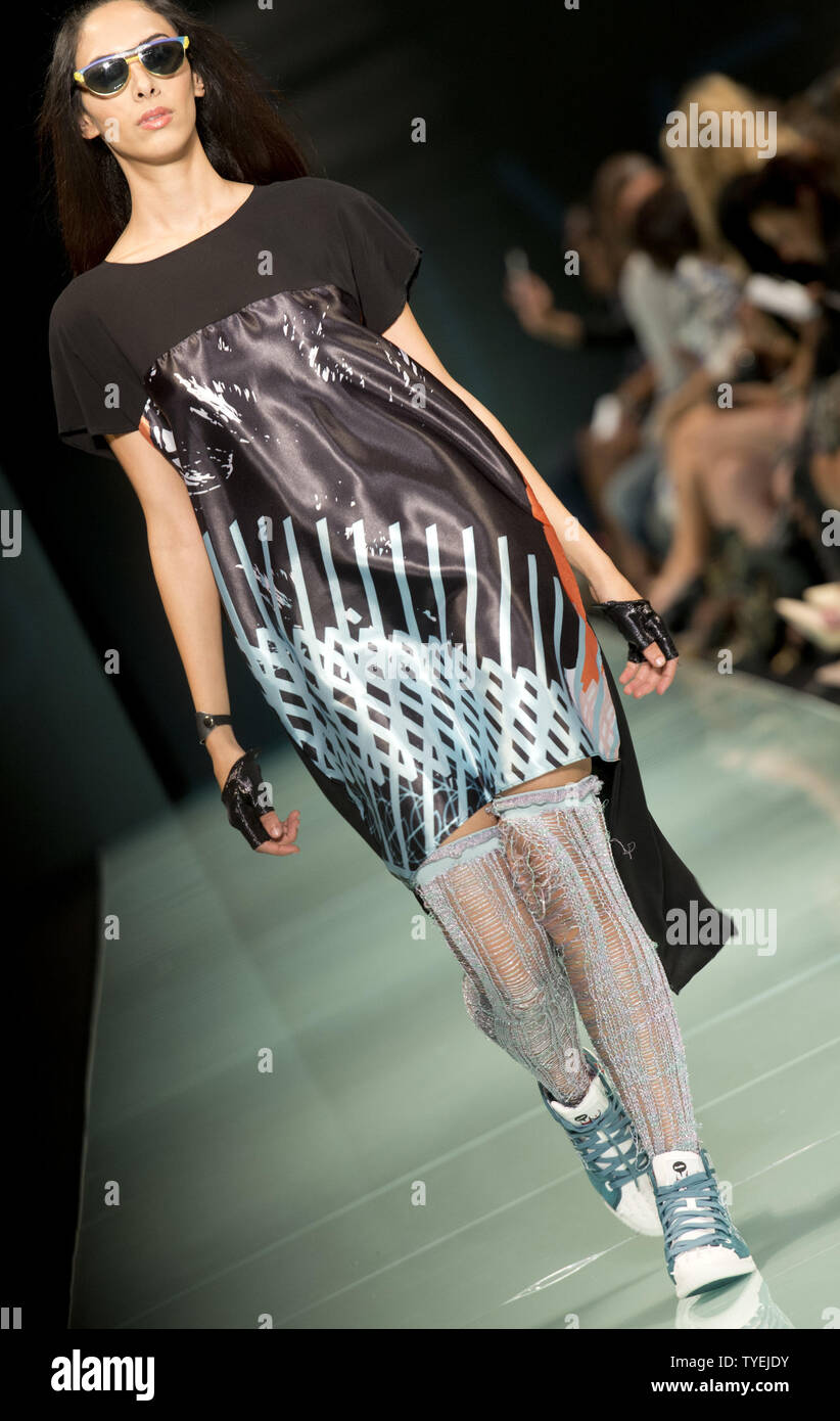 A model from Lisu Vega fashions walks on the runway at the Miami Beach ...