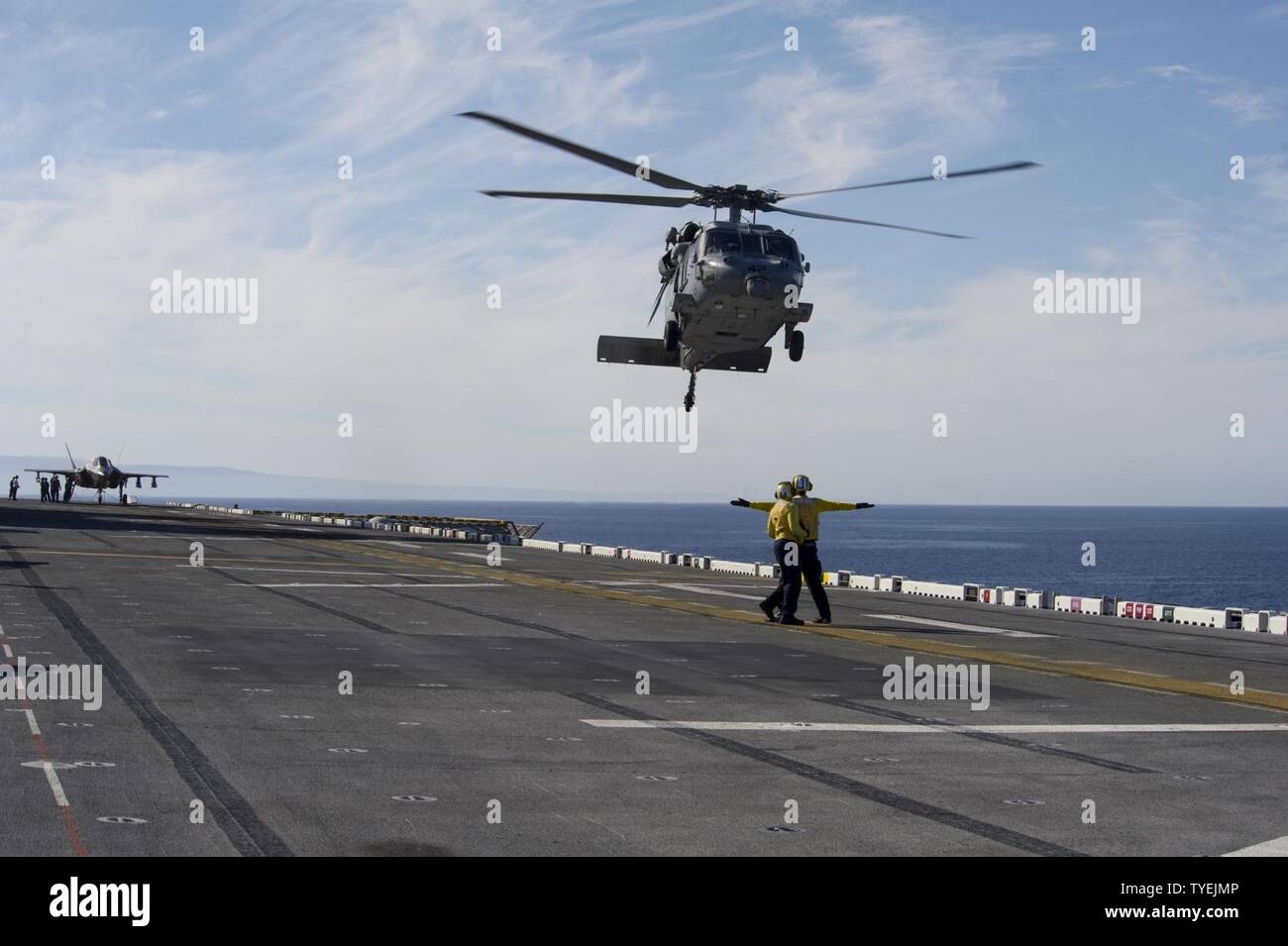 PACIFIC OCEAN (Nov. 4, 2016) Sailors direct MH-60S Seahawk helicopters ...