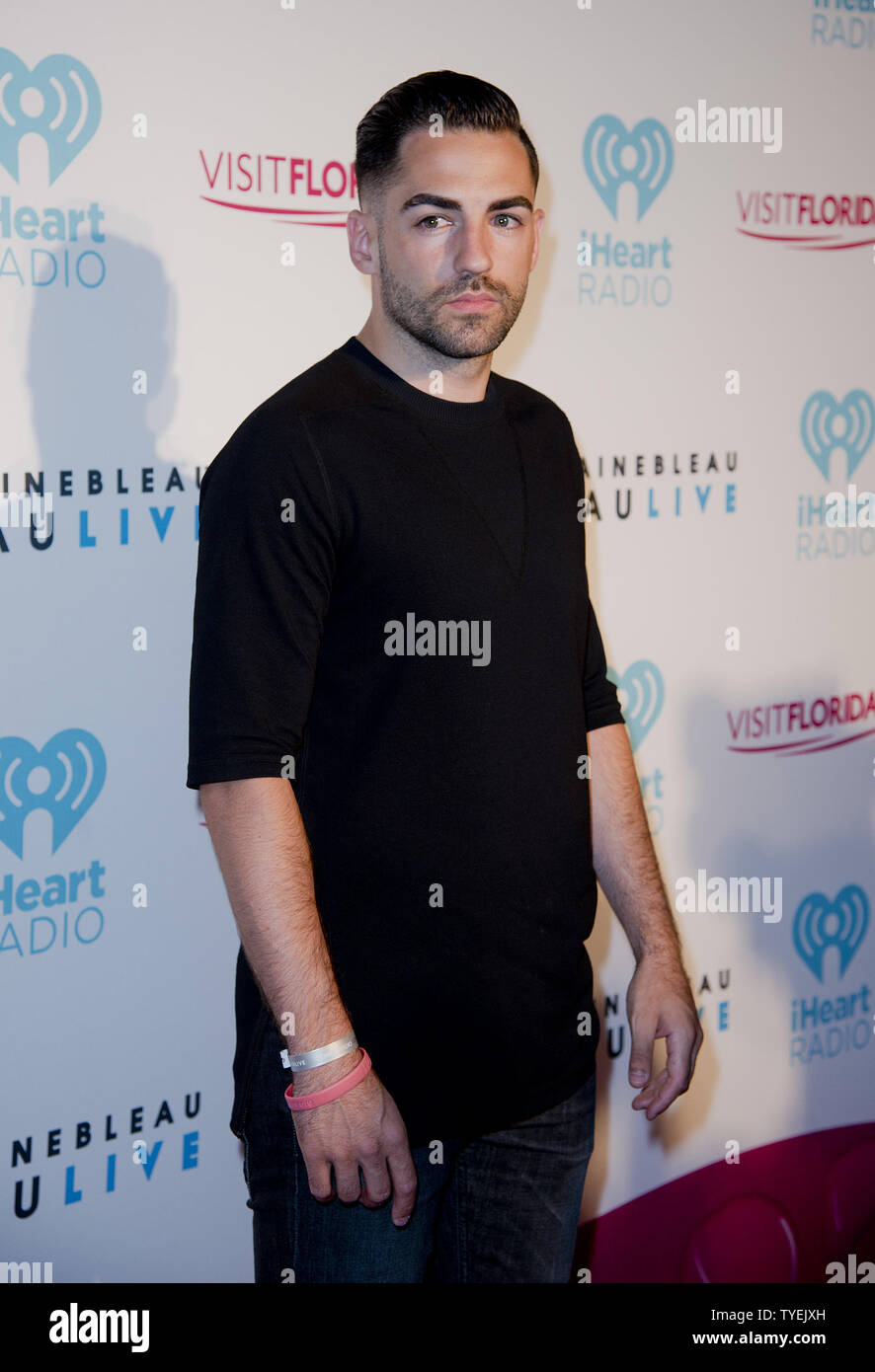 Performer DJ E.V. walks the red carpet at the Third Annual IHEARTRADIO ...
