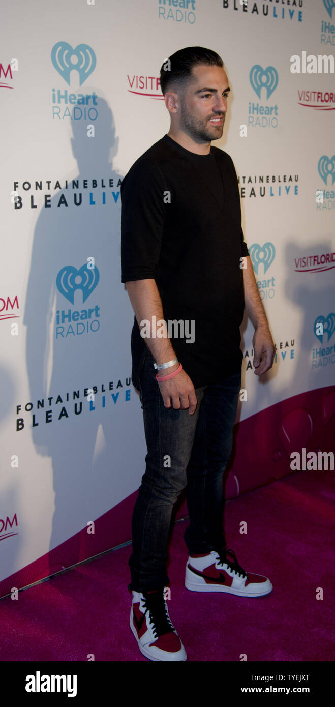 Performer DJ E.V. walks the red carpet at the Third Annual IHEARTRADIO ...
