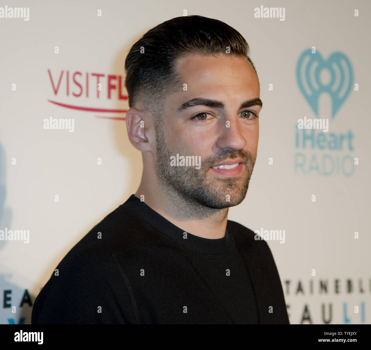 Performer DJ E.V. walks the red carpet at the Third Annual IHEARTRADIO ...