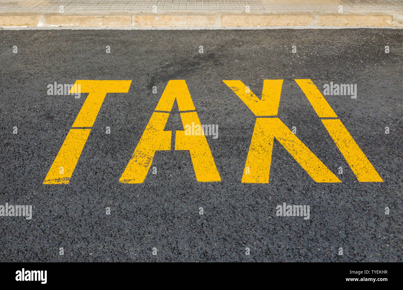 Designation of the taxi rank on the yellow paint asphalt Stock Photo ...