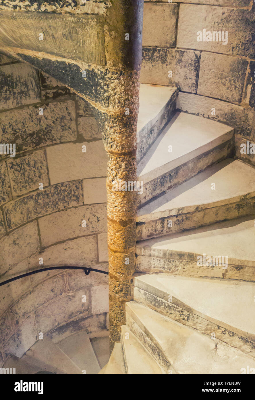 A spiral stone staircase in a narrow high tower Stock Photo - Alamy