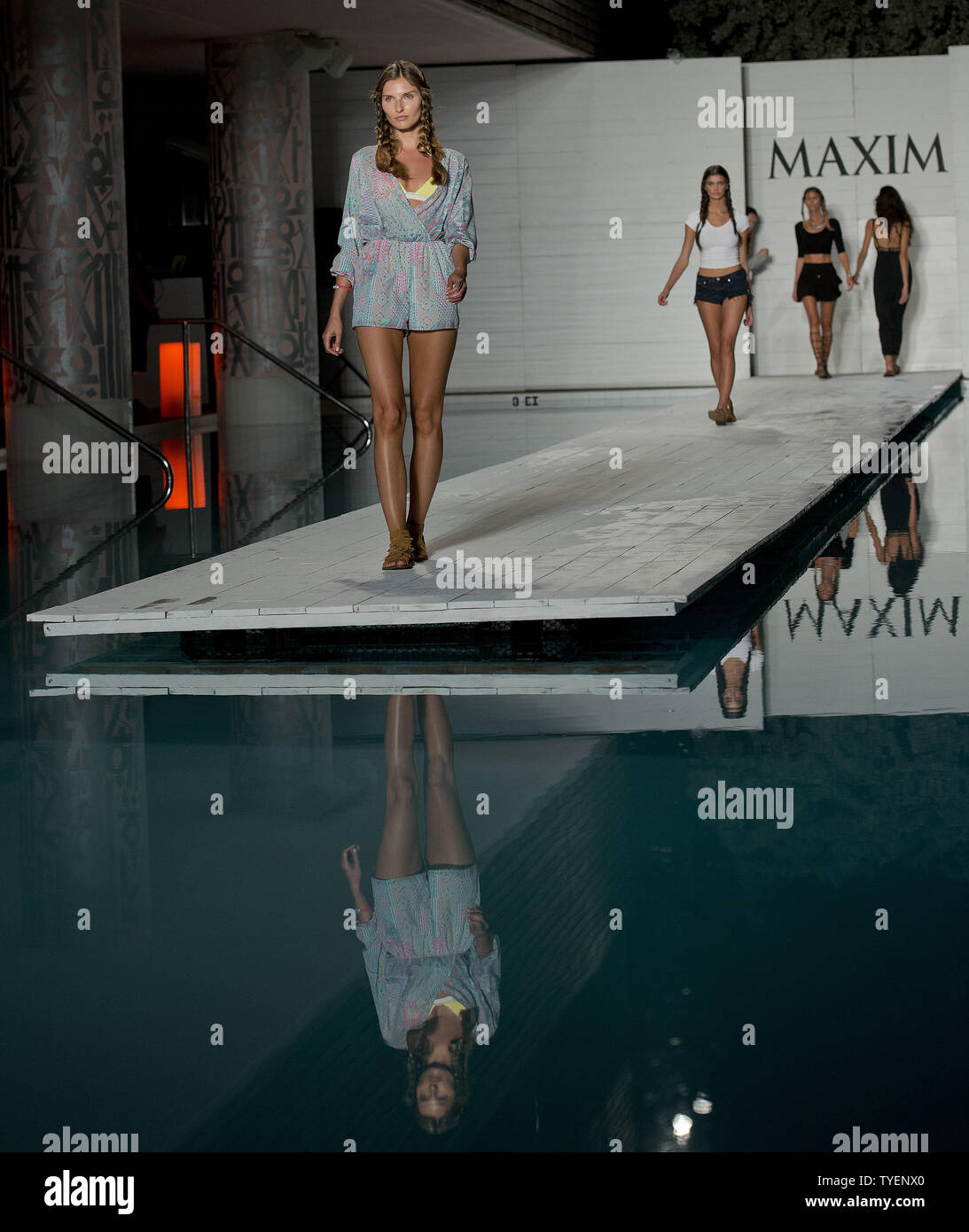 A model presents a swimsuit creation for the Maxim swimwear collection ...