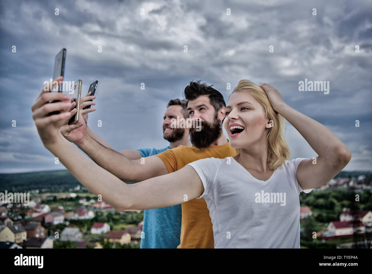 Happy best friends taking selfie with camera Stock Photo - Alamy