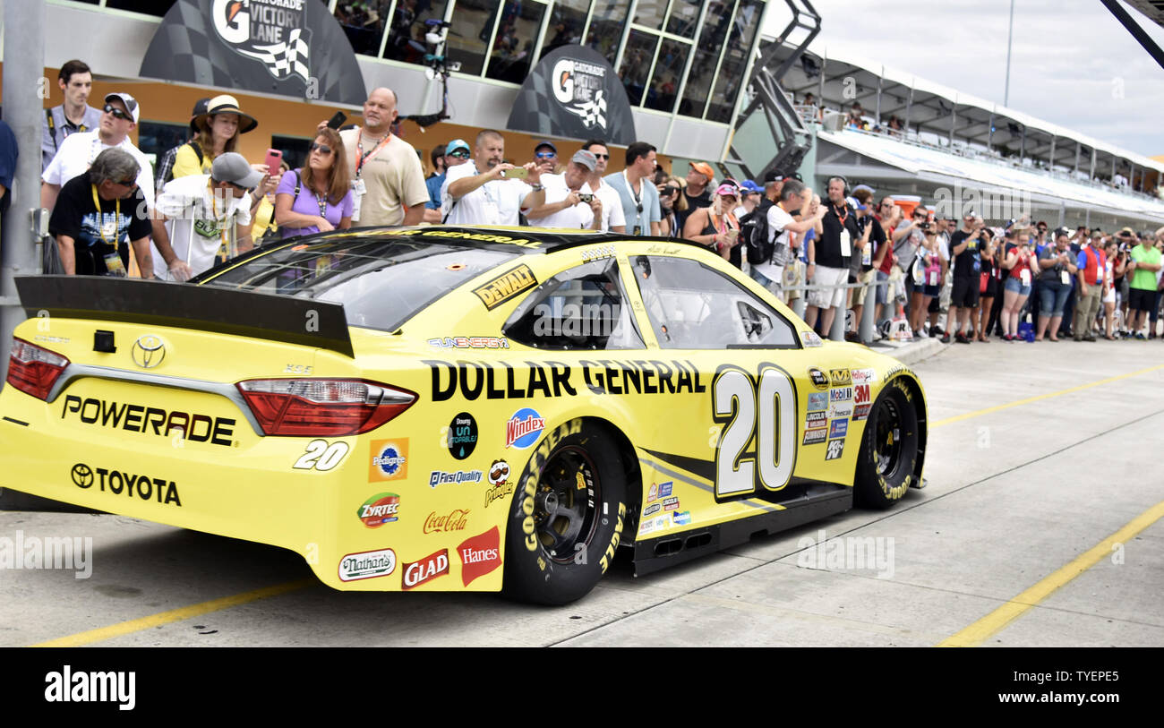 NASCAR Sprint Series fans watch as racer Matt Kenneth (20) enters the ...