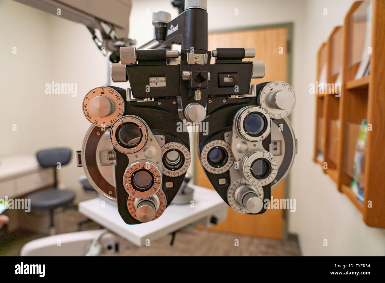 Technical image of a phoropter in an eye doctors office with background ...