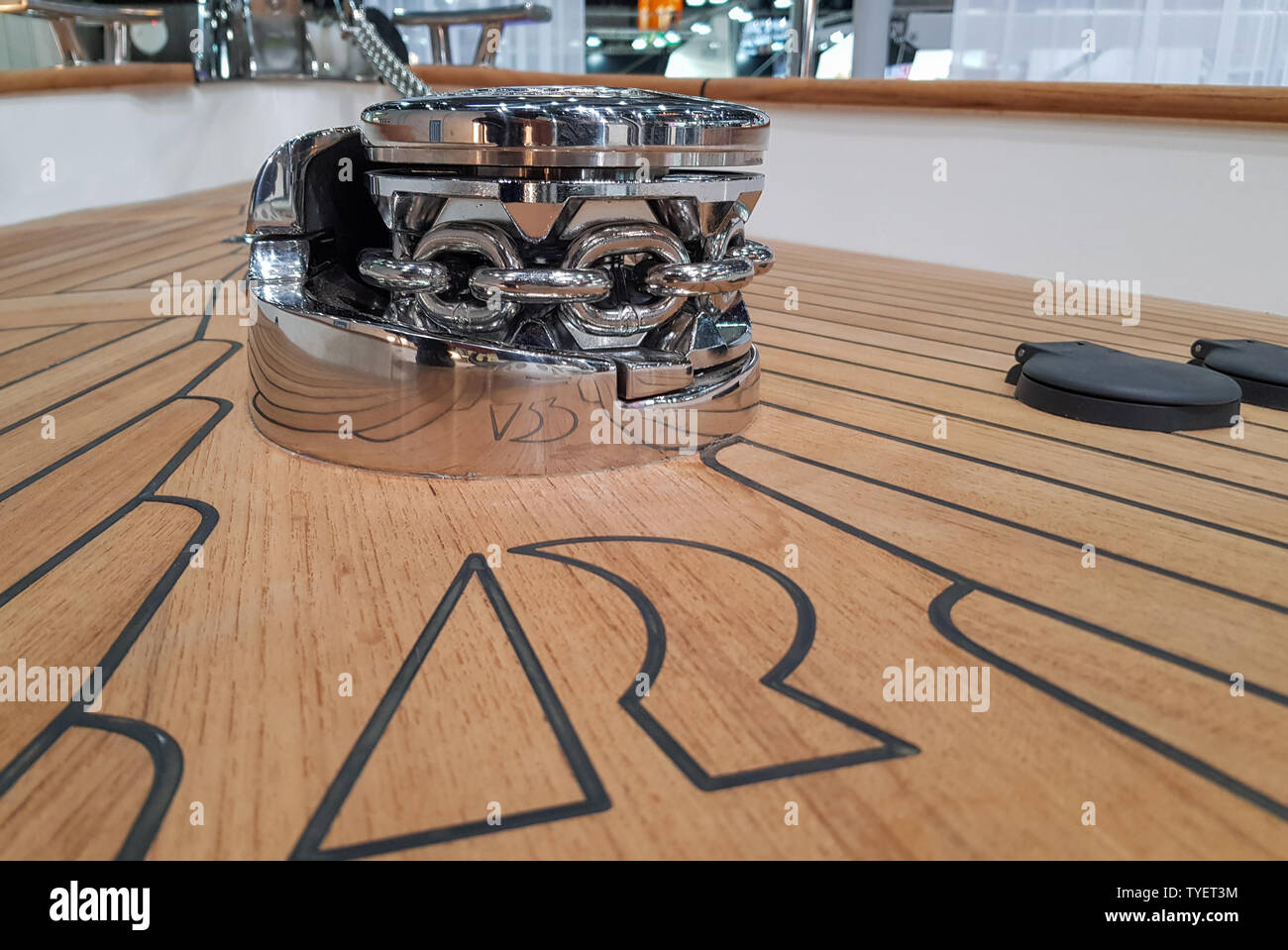 DUSSELDORF, GERMANY, JANUARY 23, 2018: Anchor winch on the teak deck of ...