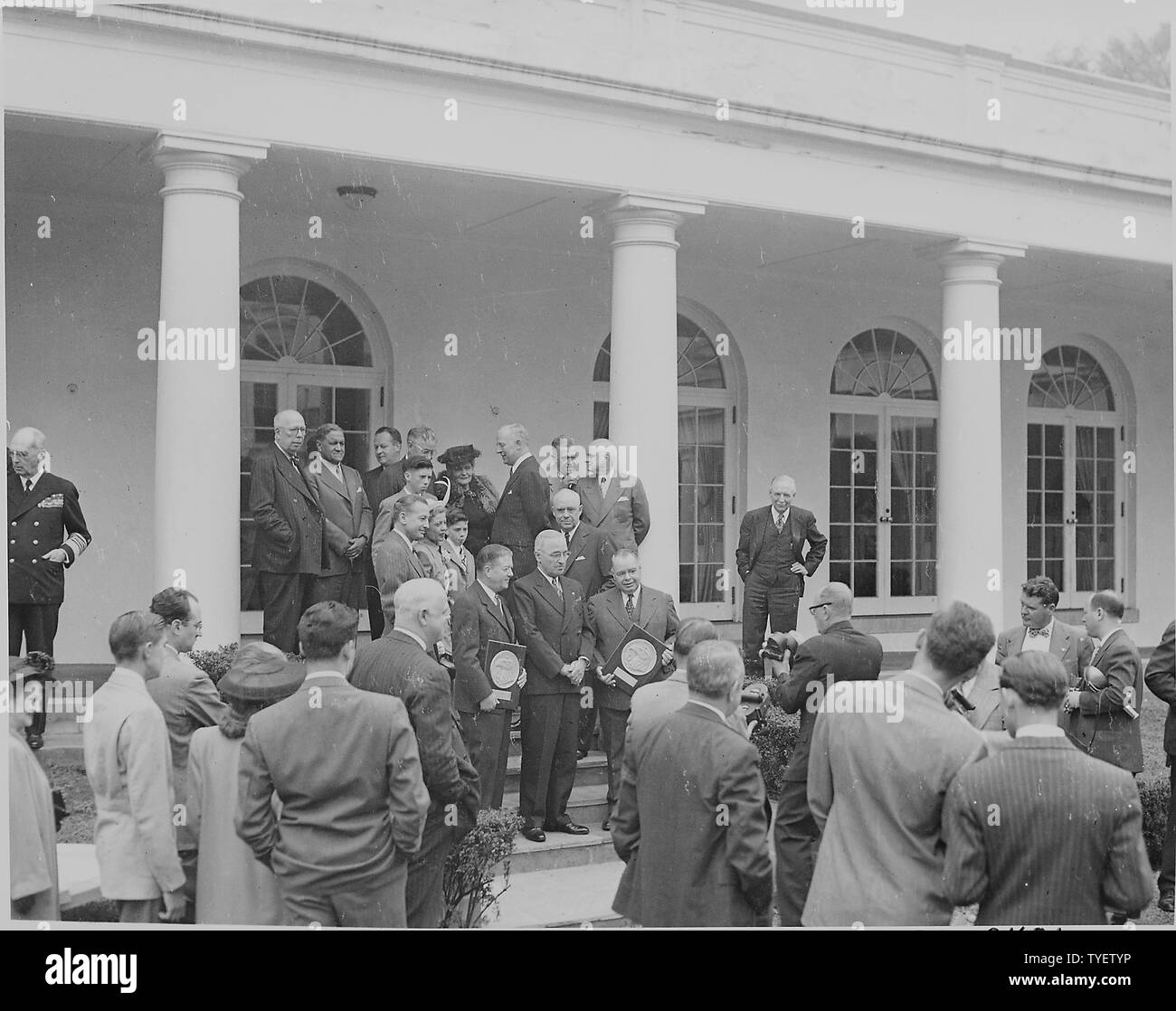 Photograph of ceremony at the White House at which President Truman ...