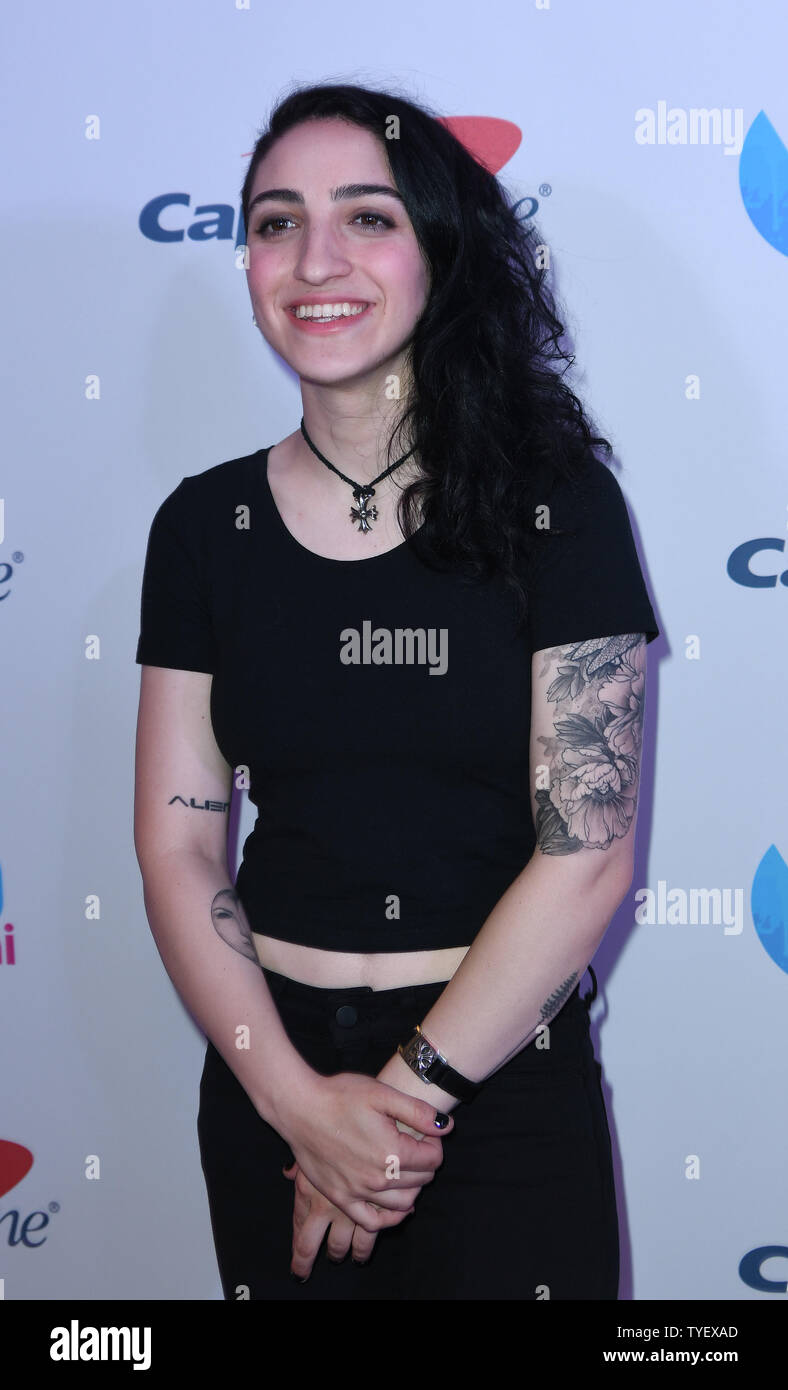 Performer Emily Estefan walks the red carpet at the Y100 JingleBall ...