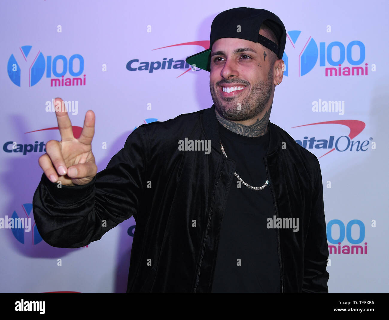 Performer Nicky Jam walks the red carpet at the Y100 JingleBall 2016 ...