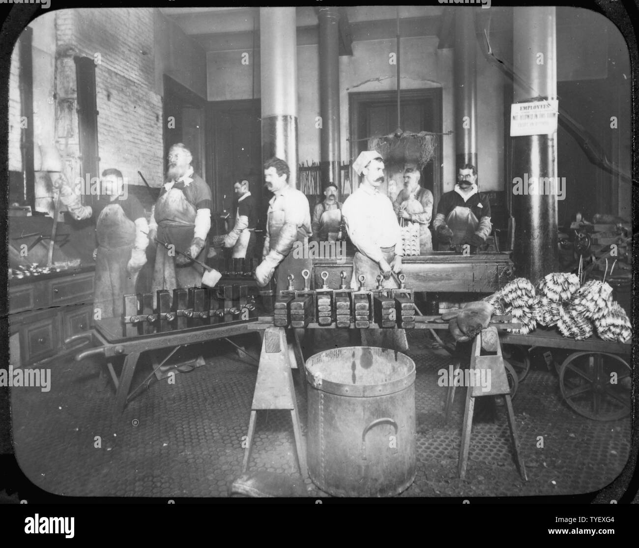 Photograph of eight San Francisco Mint employees in the basement area ...