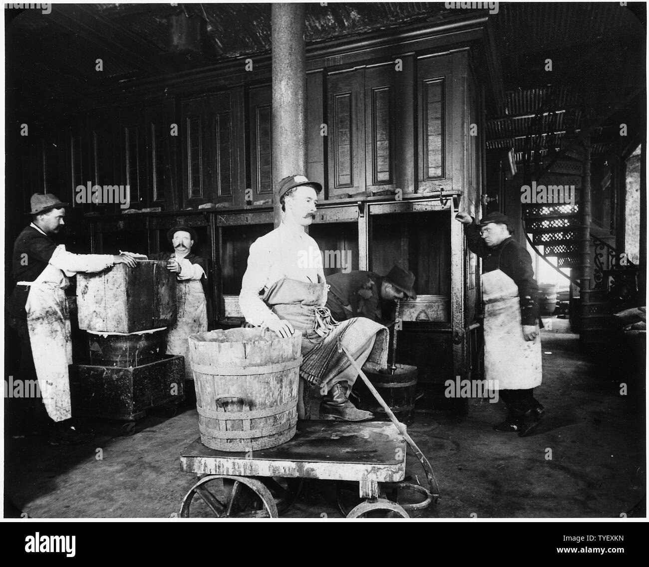 Photograph of five San Francisco Mint employees in what appears to be ...