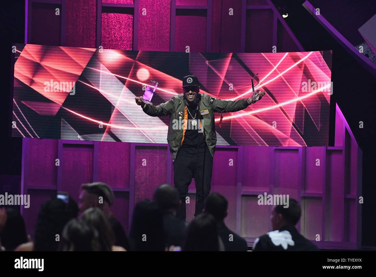 Latin artist Nicky Jam accepting award during the 2017 Billboard Latin ...