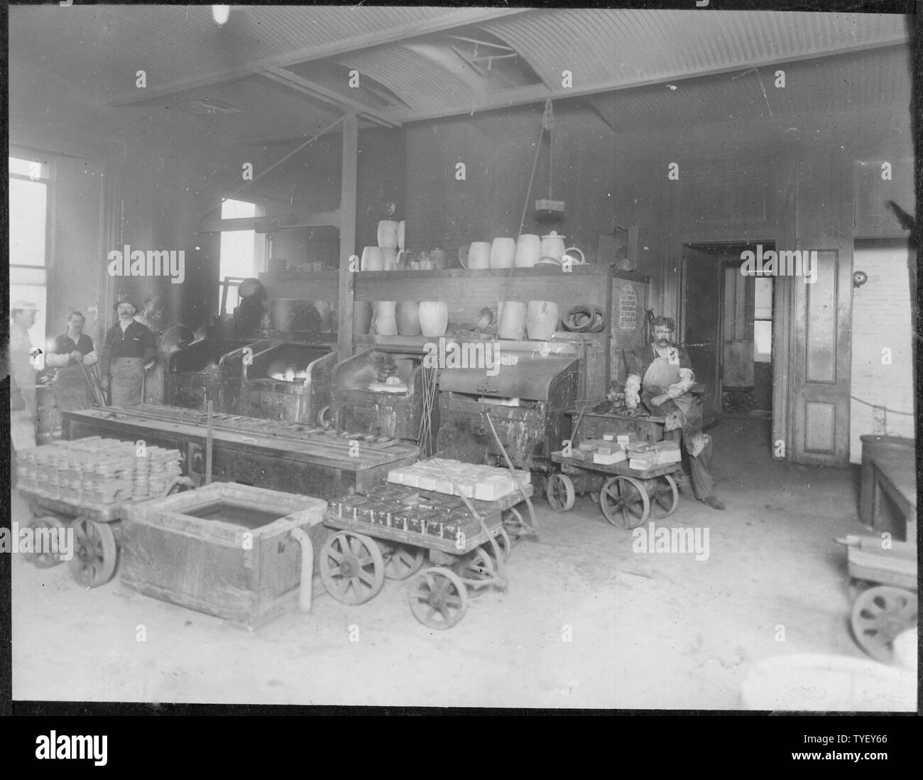 Photograph of four San Francisco Mint employees in the melting and ...