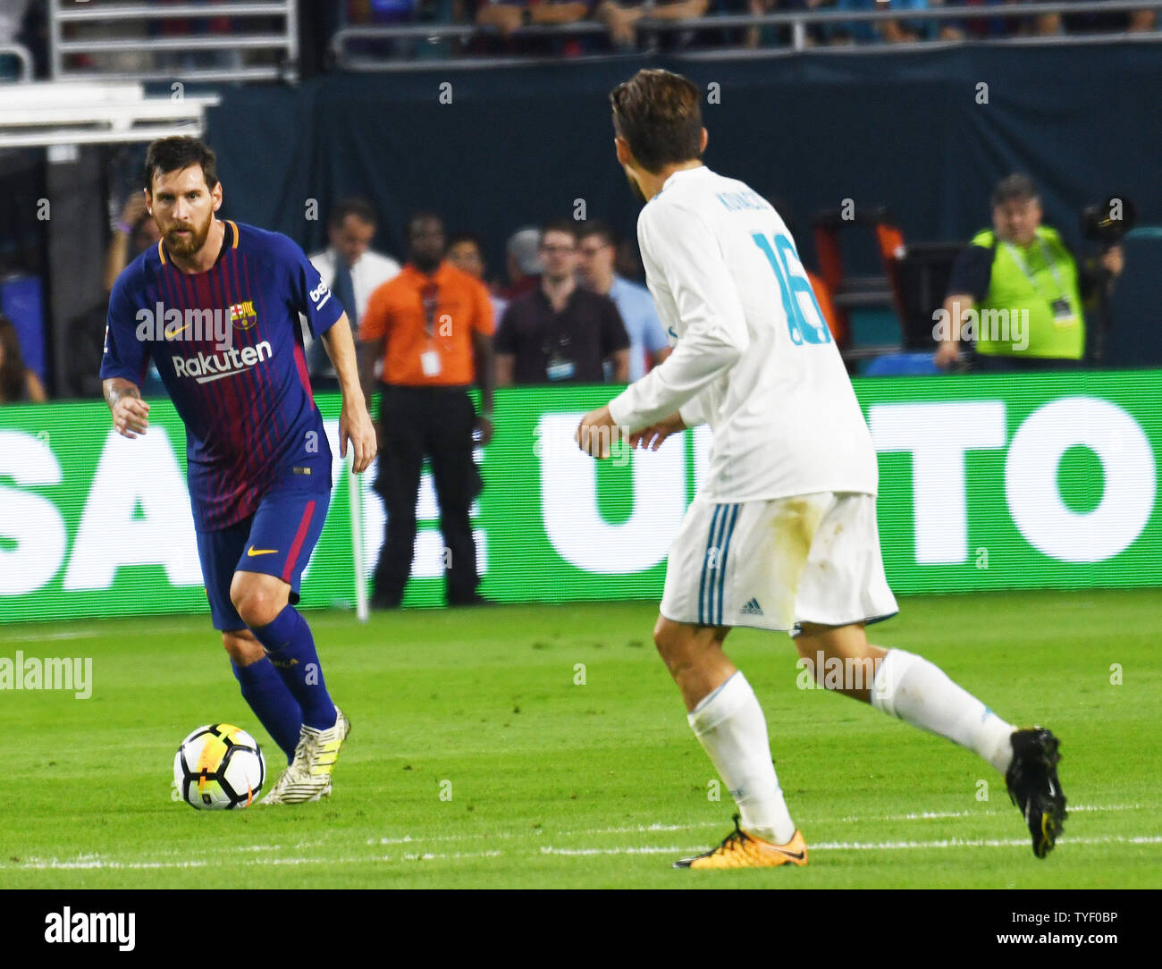 Barcelona's Lionel Messi (L) dribbles the ball in the first half of the ...