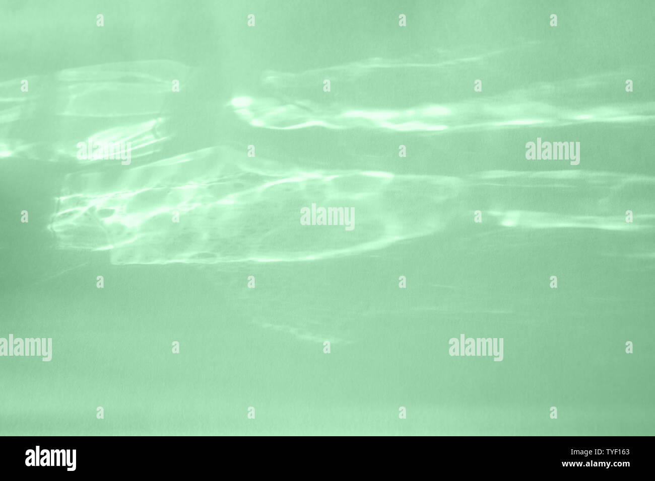 Trendy mint colored abstract background with light and shadows caustic ...