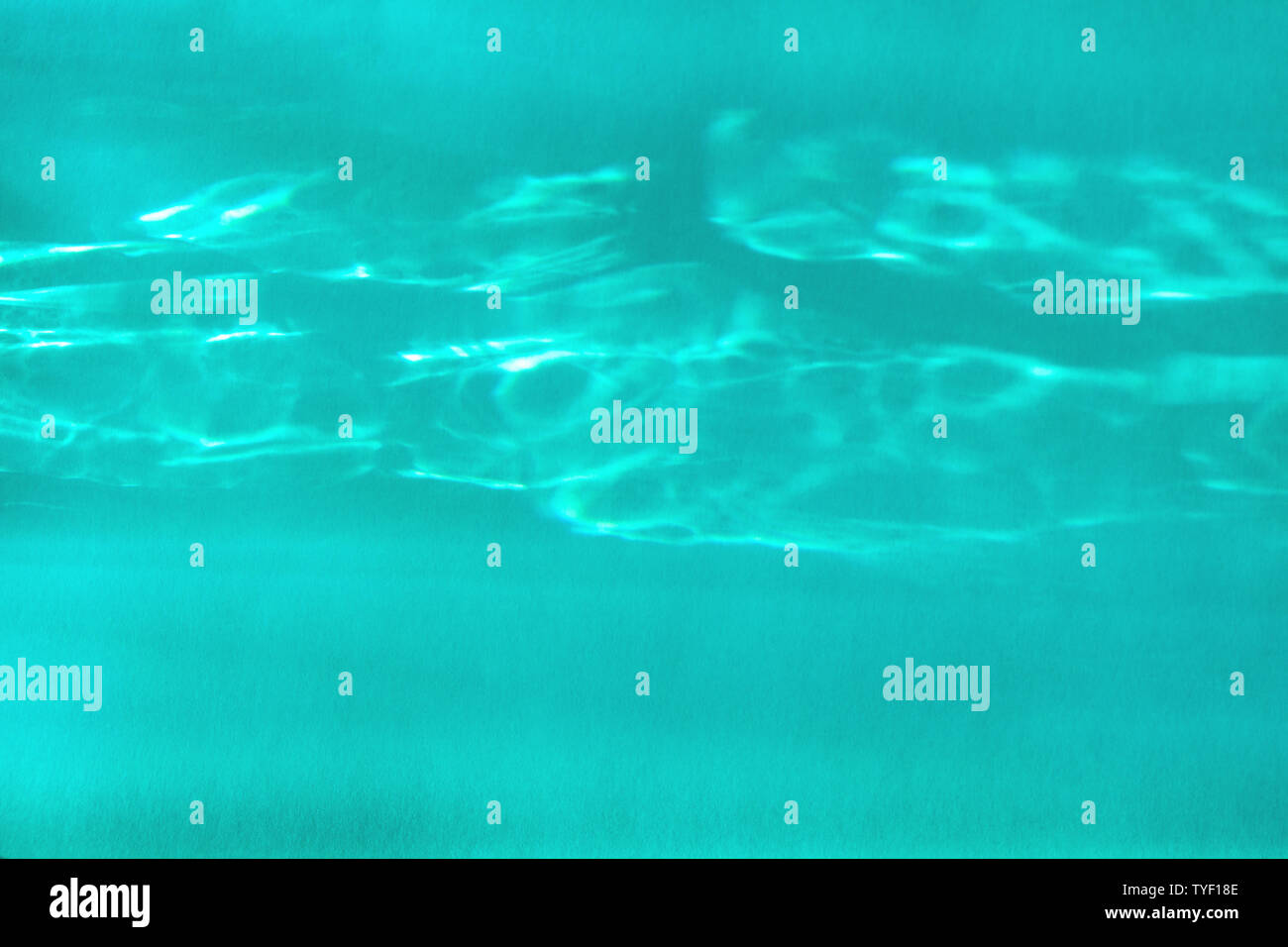 Trendy blue colored abstract background with light and shadows caustic ...