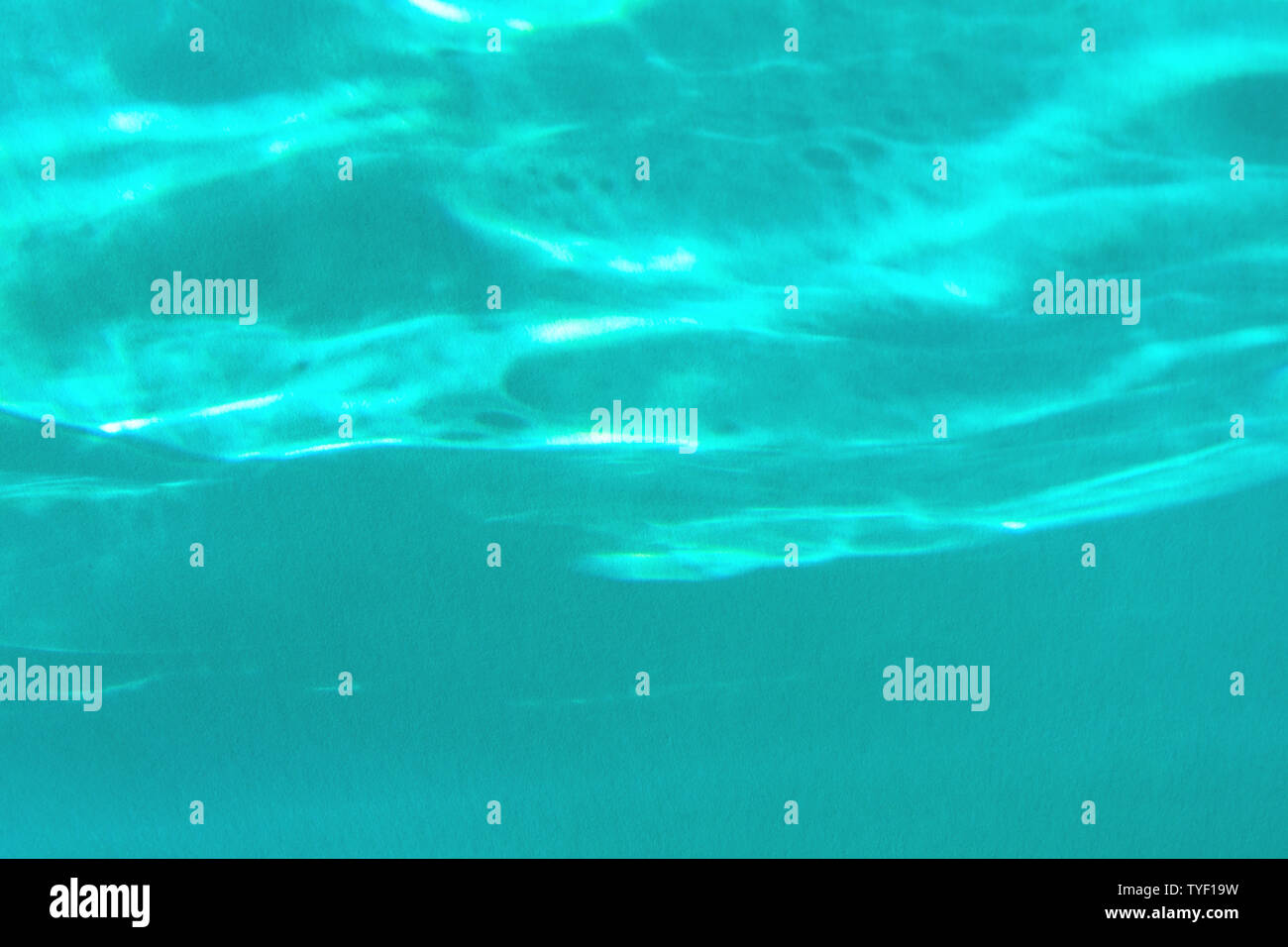 Trendy blue colored abstract background with light and shadows caustic ...