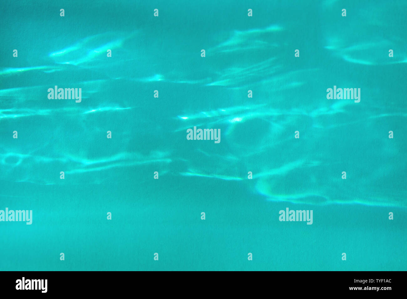 Trendy blue colored abstract background with light and shadows caustic ...