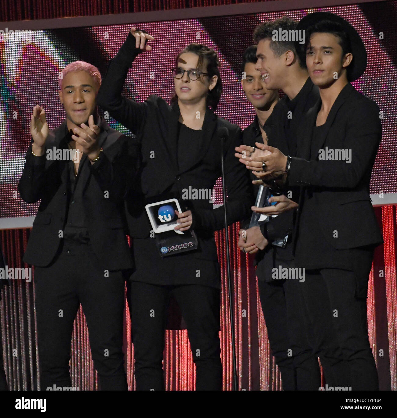 Artist CNCO accept an award at the 2017 Telemundo Premios Tu Mundo show at the American Airlines ...