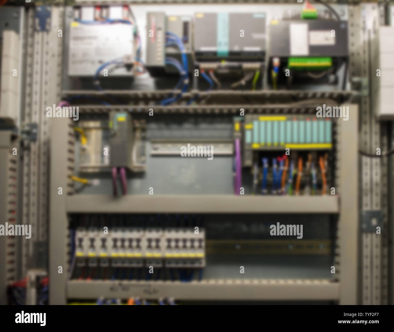 Electric control panel. Blurred engineering background Stock Photo - Alamy