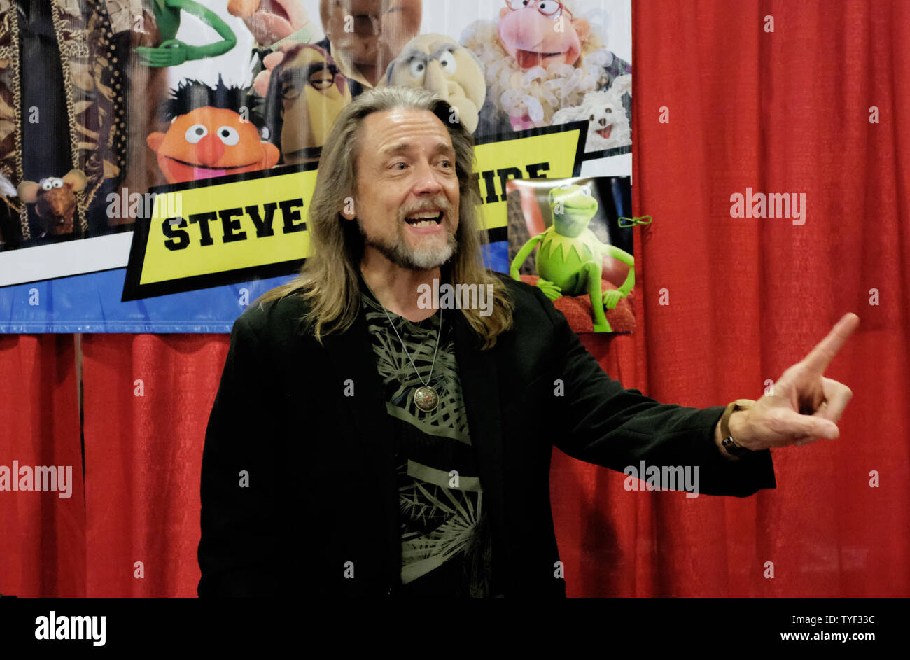 Steve Whitmire stand next to his picture of Kermit in his booth at the ...