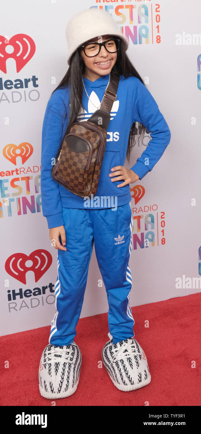 DJ Livia walks the red carpet at the IHeartRadio Fiesta Latina 2018 ...